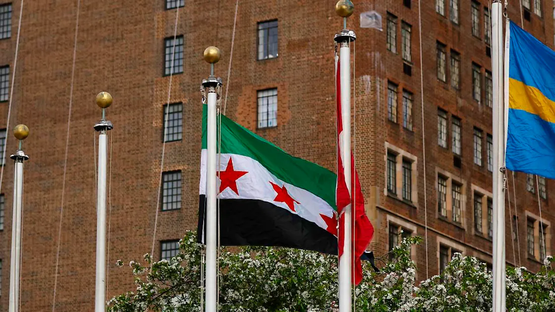 International: New Syrian flag raised in front of UN headquarters in ...