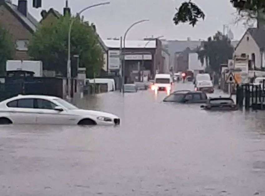 Heavy rain floods western Germany - pictures show streets under water ...