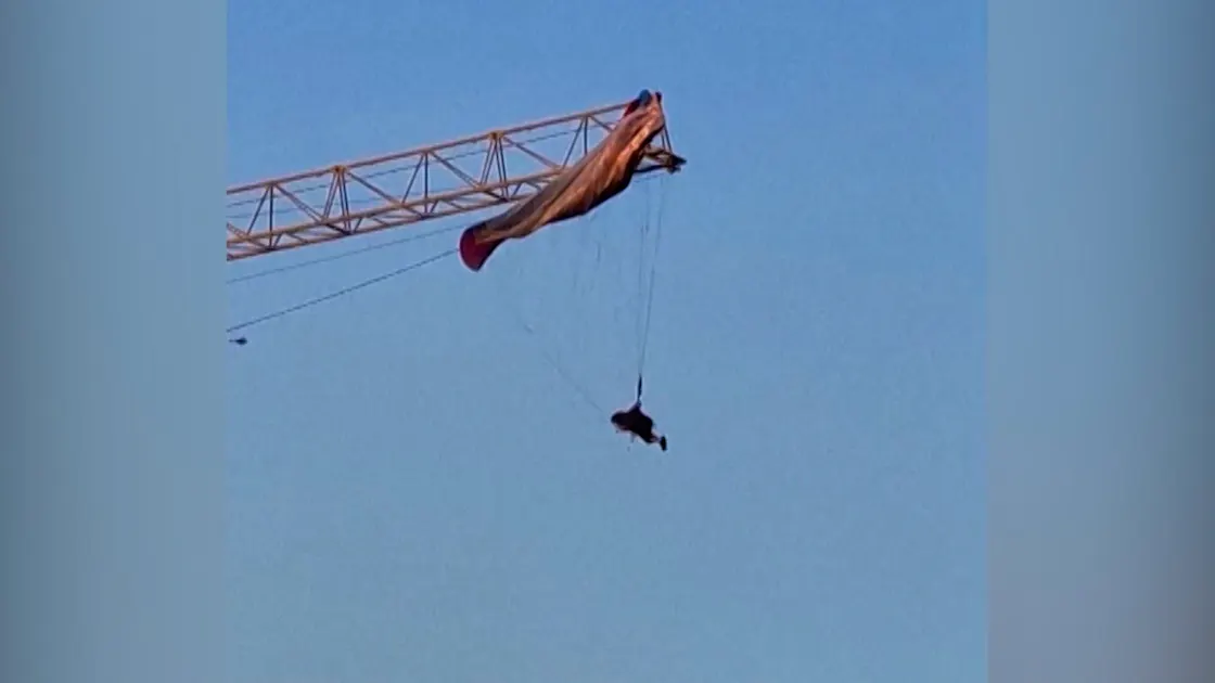 Hang on in the air for hours: Paraglider gets caught on construction ...